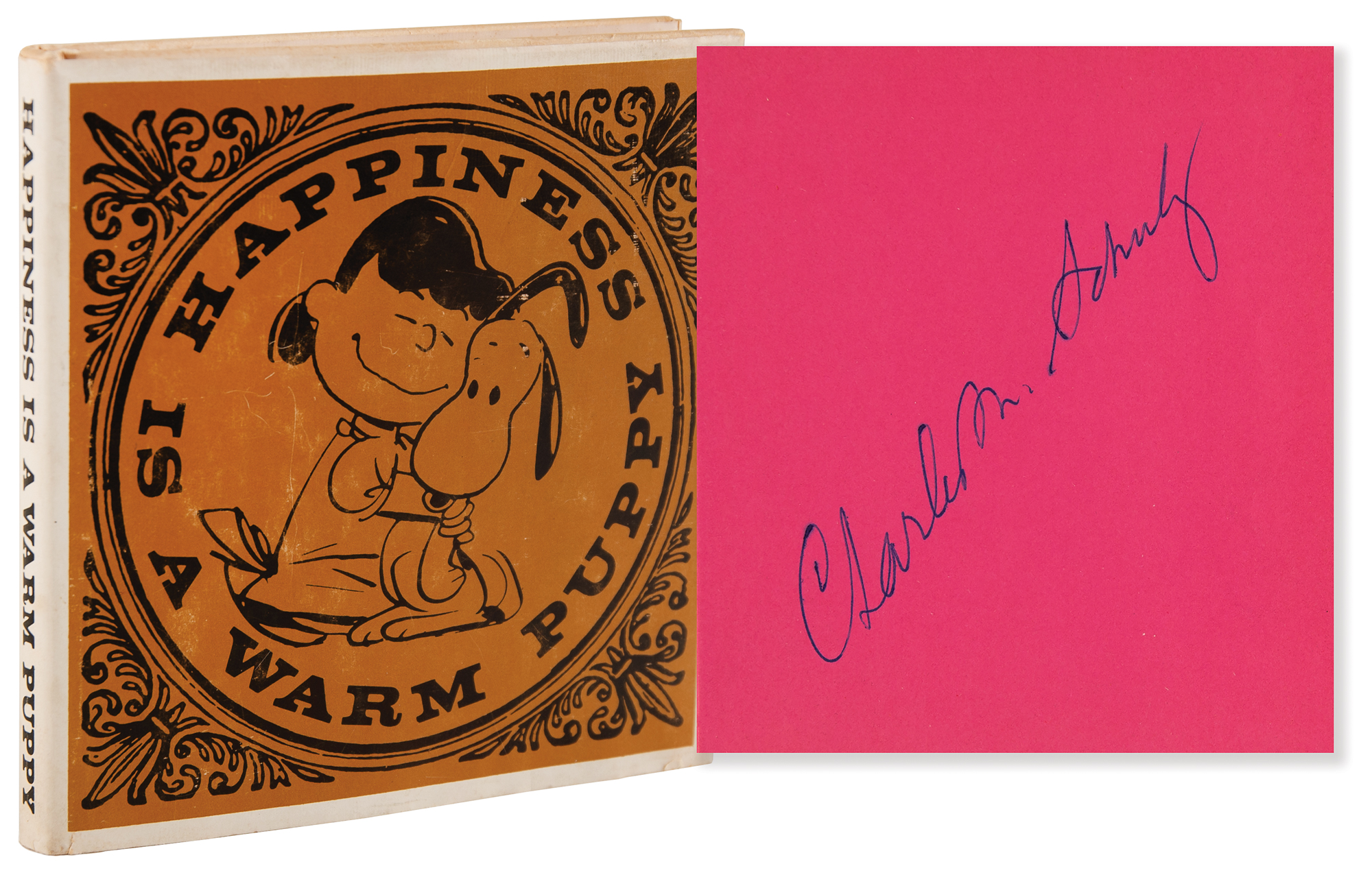 Charles Schulz Signed Book - Happiness Is a Warm Puppy | RR Auction